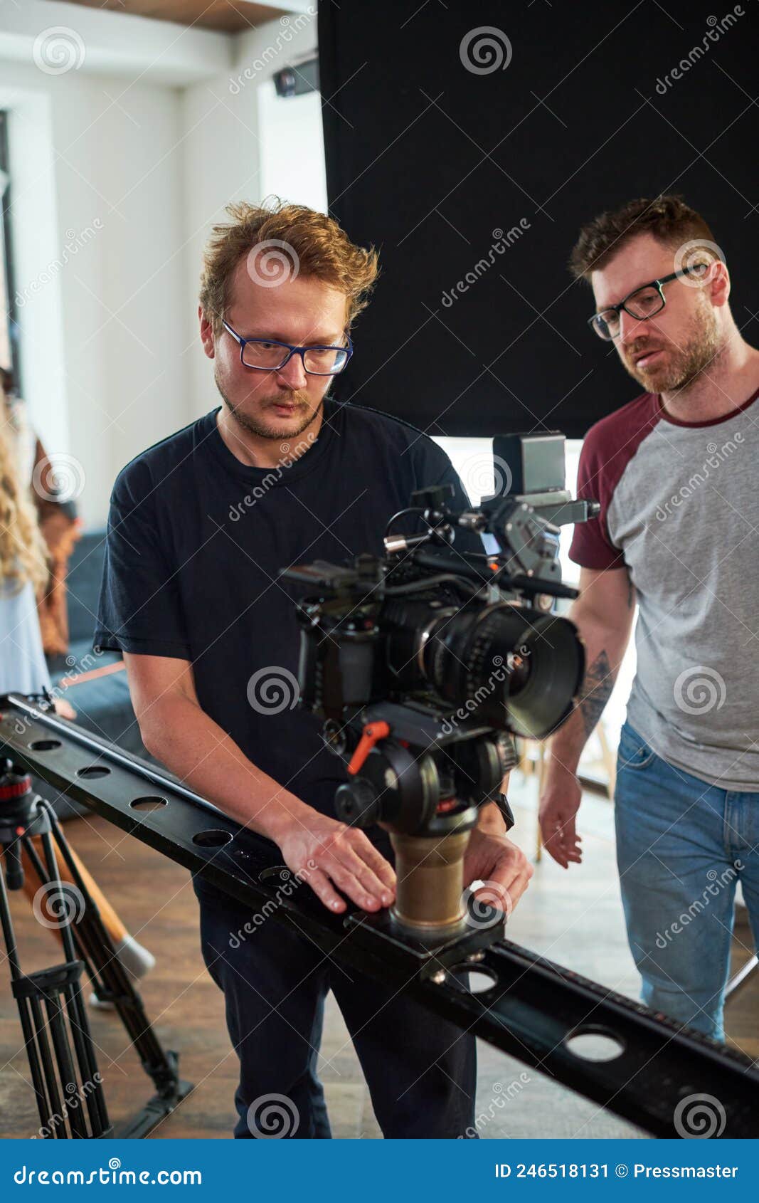 Young Professional Videographer Moving Video Camera Along Slider Stock ...