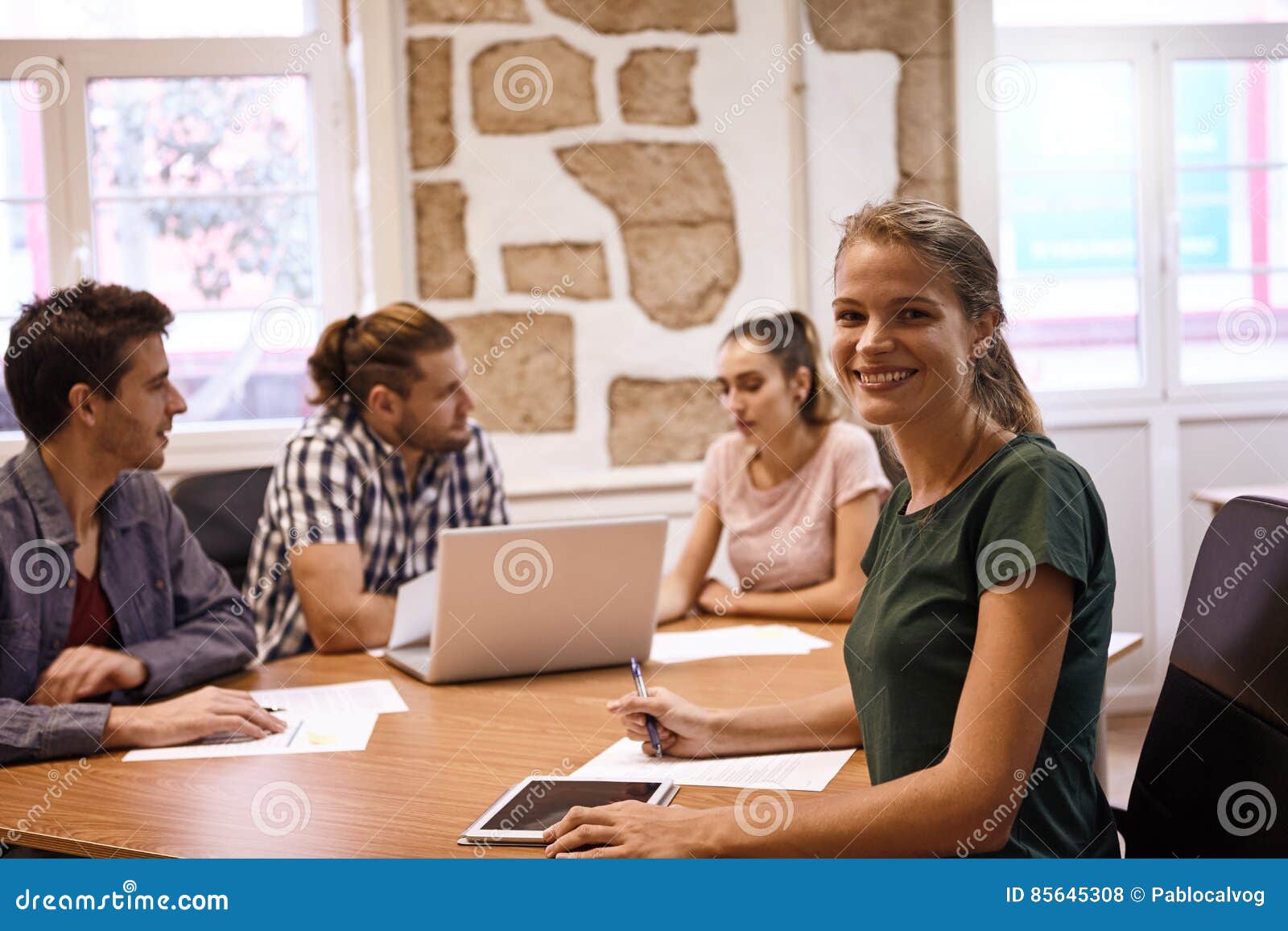 Young Professionals in a Brainstorming Session Stock Photo - Image of ...