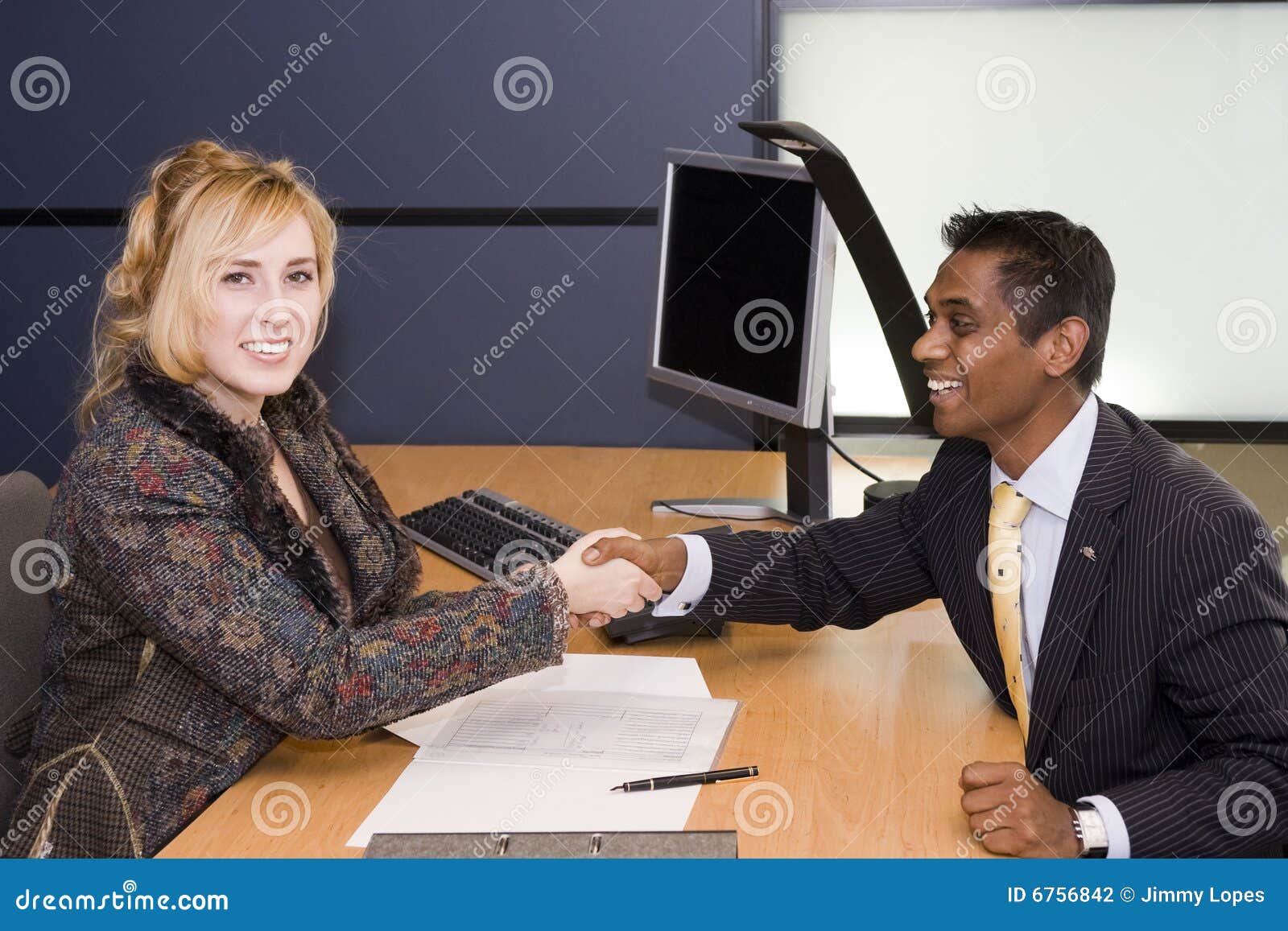 Young Professionals Handshaking on a Deal Stock Photo - Image of ...