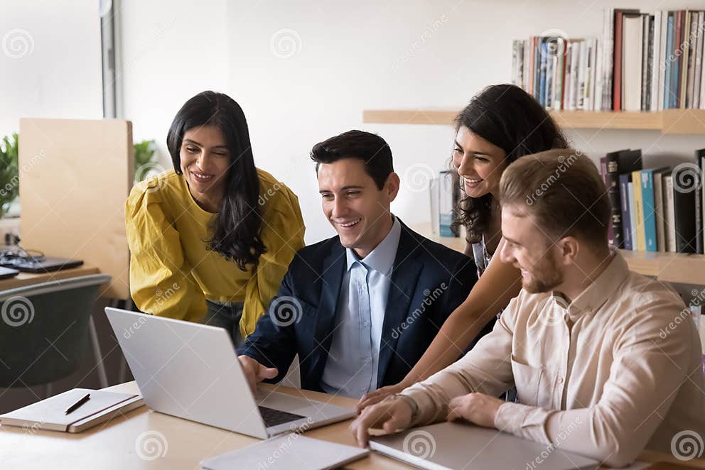 Young Professor Work on Project with Students Group Using Notebook ...