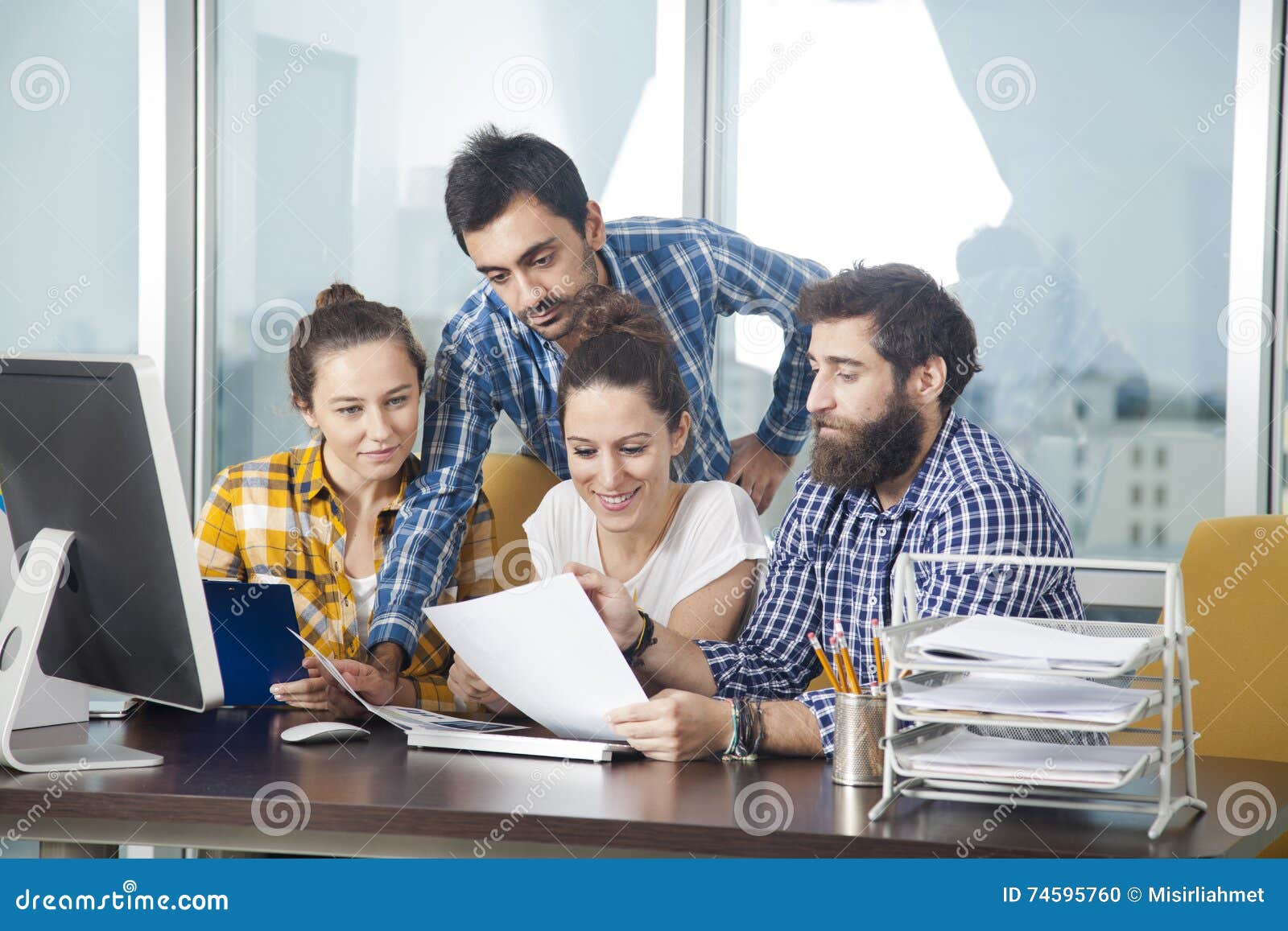 Young Proffessional Team Working Together in the Office Stock Photo ...