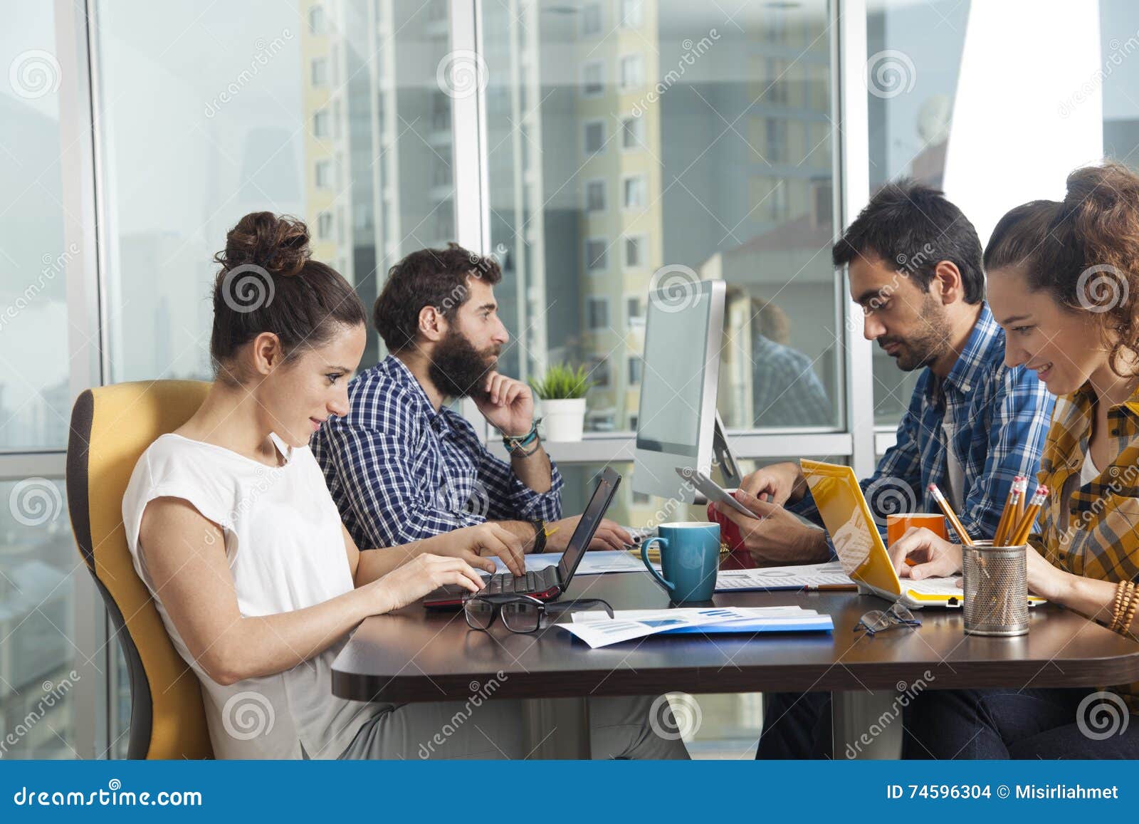 Young Proffessional Team Working Together in the Office Stock Photo ...