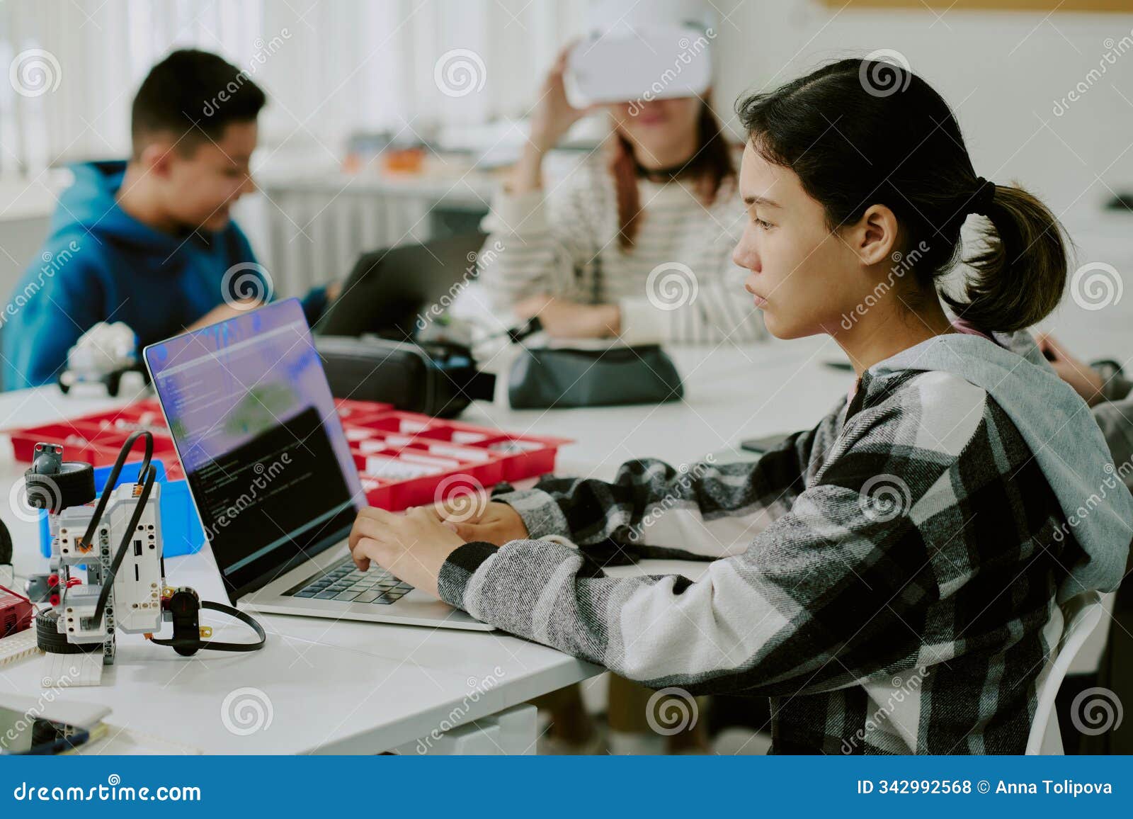 Girl with Pony Tail Coding at Desk Stock Photo - Image of education ...