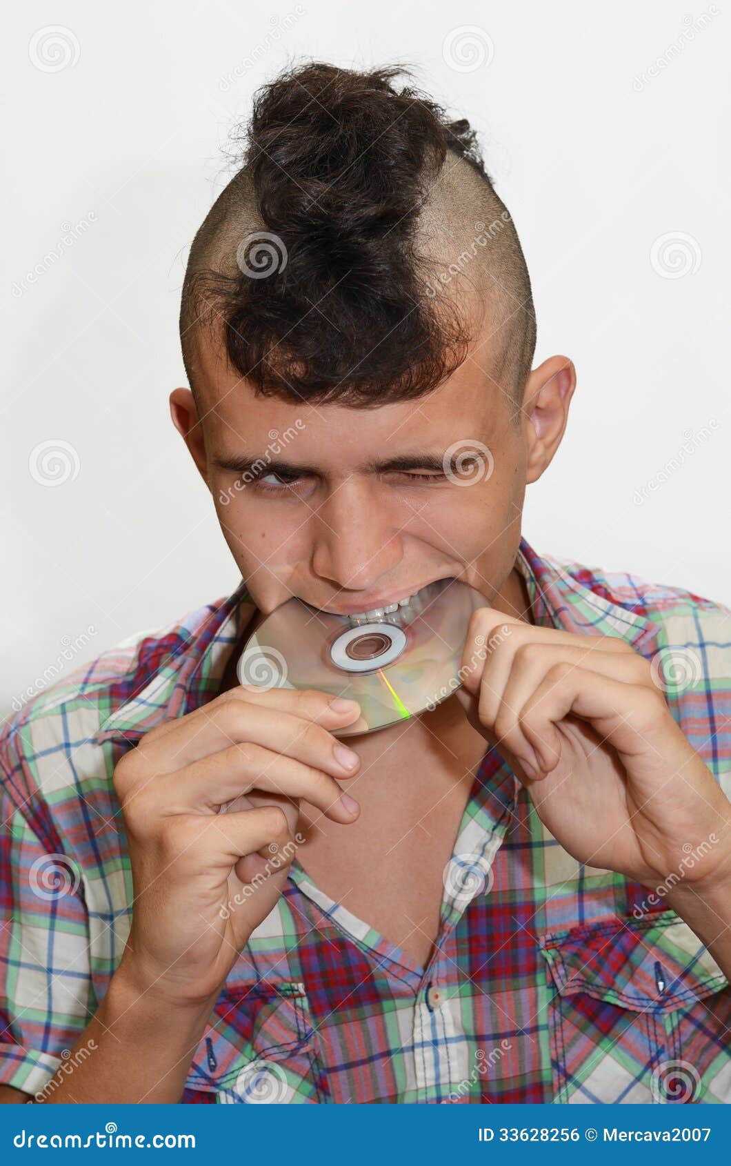 Young punk bites CD. stock photo. Image of real, music - 33628256