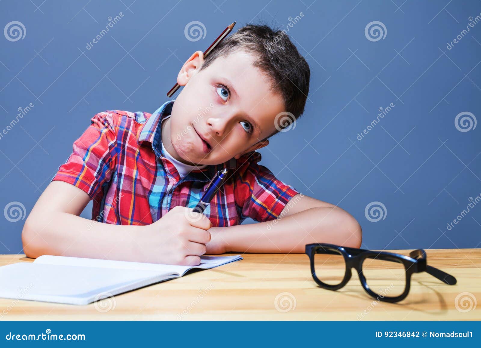 Young Pupil at the Desk Doing Homework Stock Photo - Image of college ...