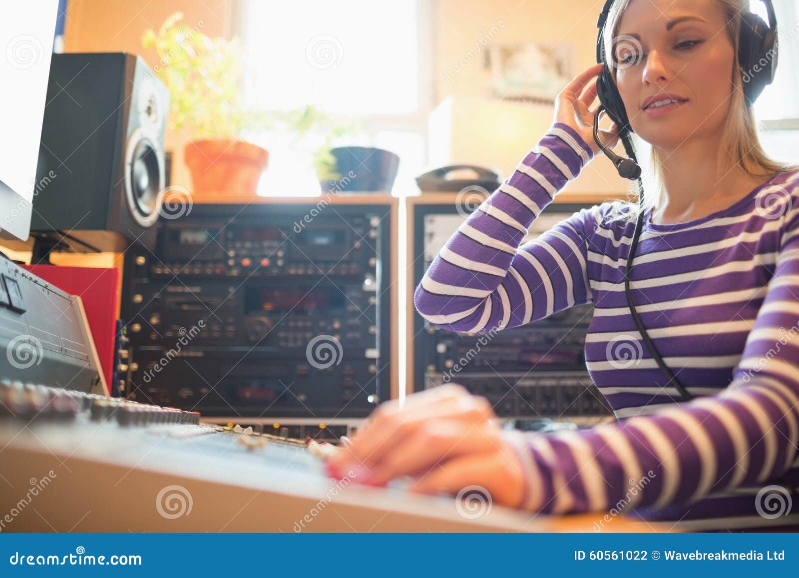 Young Radio Host Using Sound Mixer in Studio Stock Photo - Image of ...
