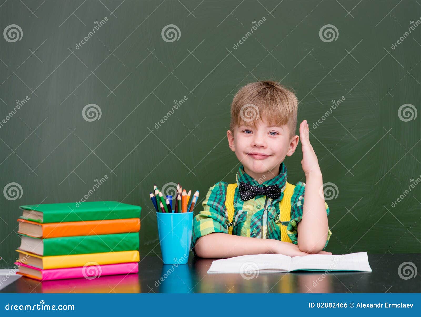 Young Raising Hand Knowing the Answer To the Question Stock Photo ...