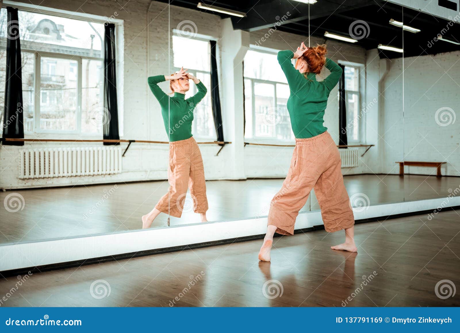 Young Red-haired Dance Teacher with a Hair Bun Looking Artistic Stock ...