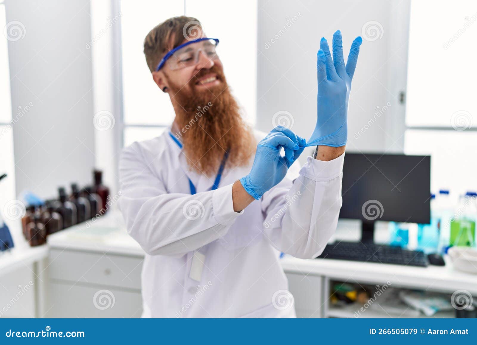 Young Redhead Man Wearing Scientist Uniform Wearing Gloves at ...