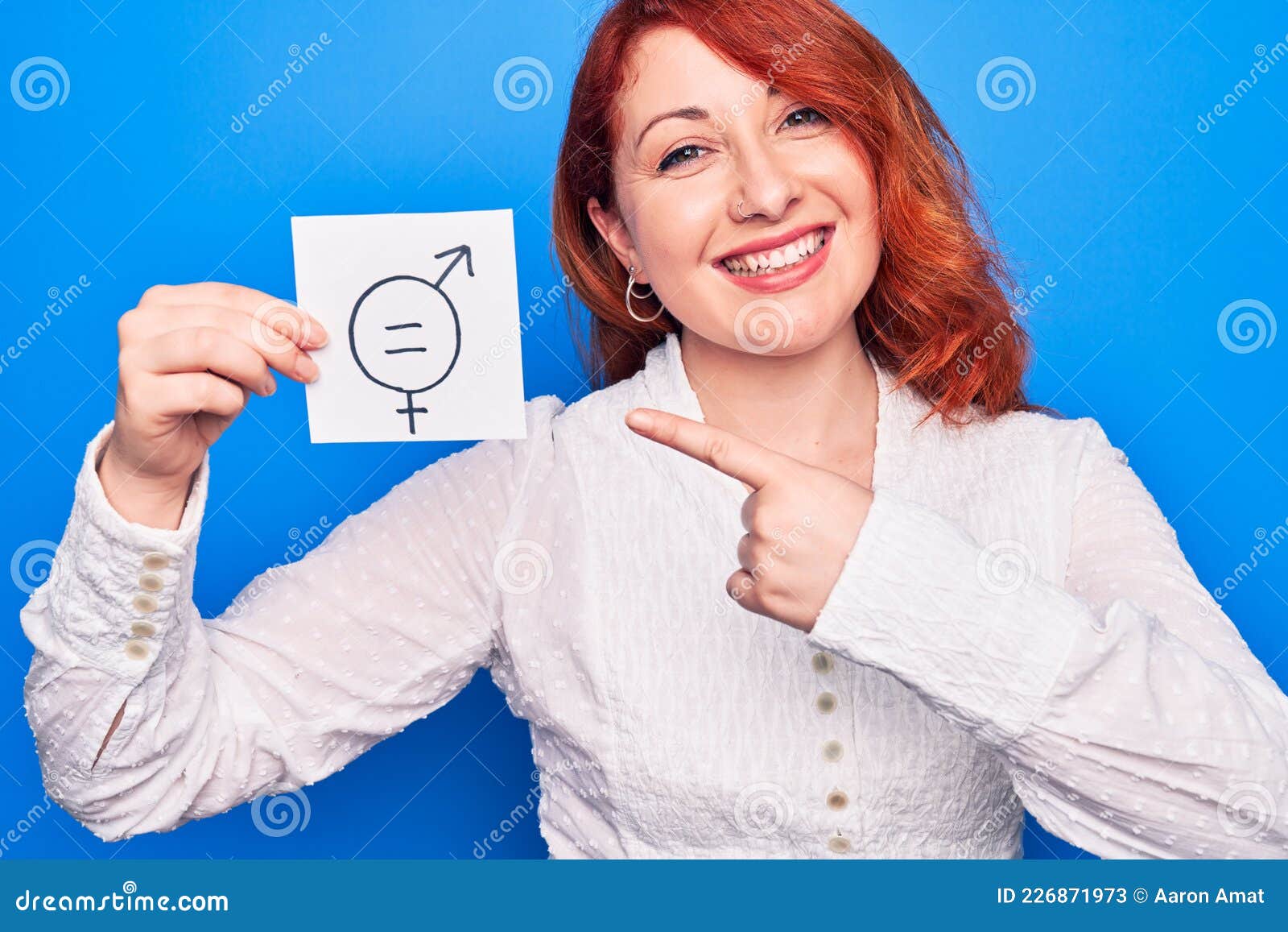 Young Redhead Woman Asking For Sex Discrimination Holding Paper With