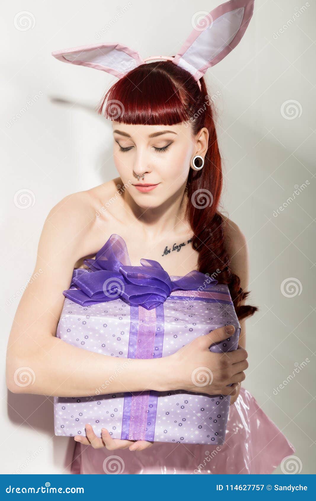 Young Redhead Woman In A Bunny Suit With Ts Stock Image Image Of Fluffy Embraces 114627757