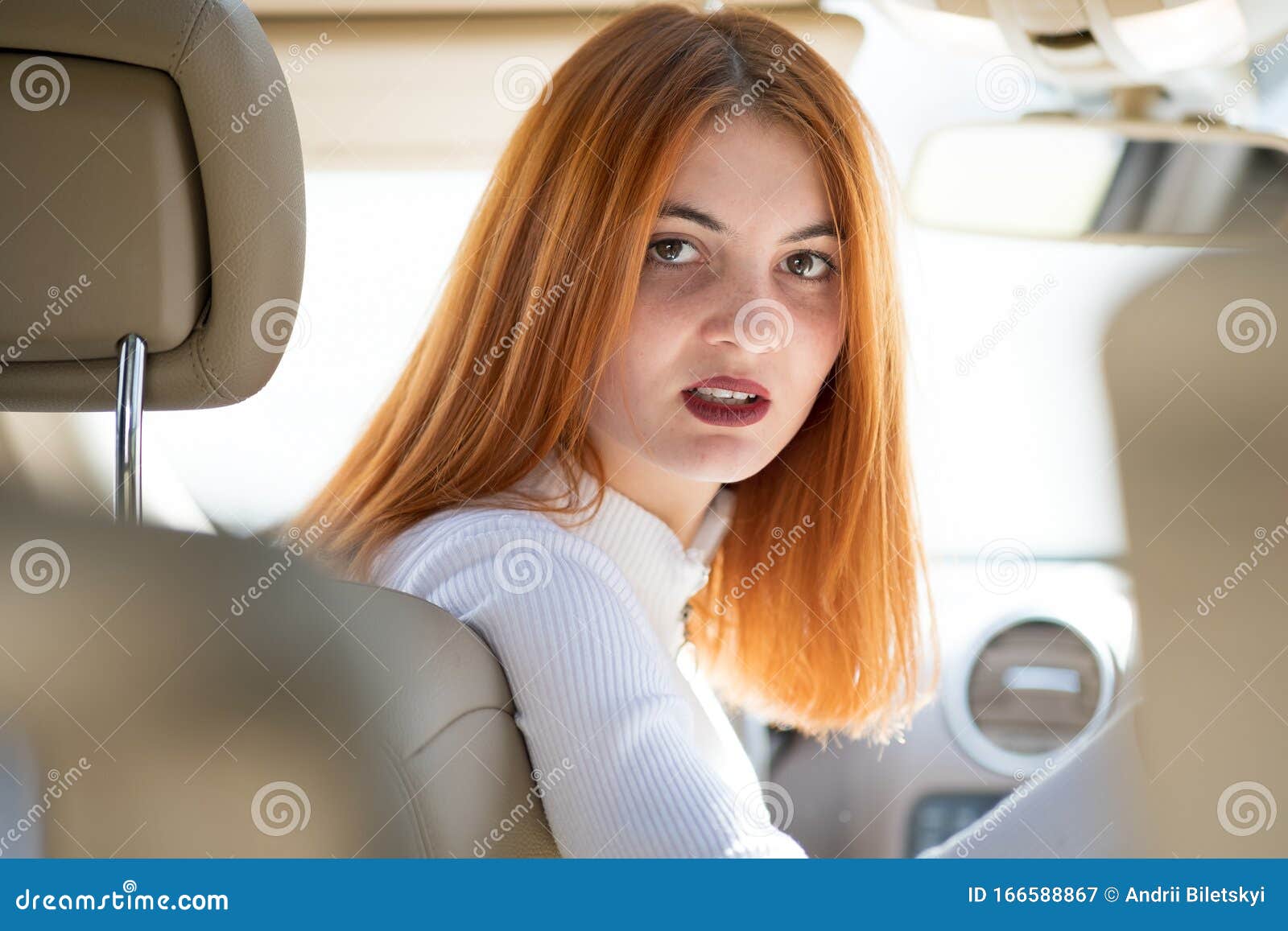 Young Redhead Woman Driver Driving a Car Backwards Stock Image - Image ...
