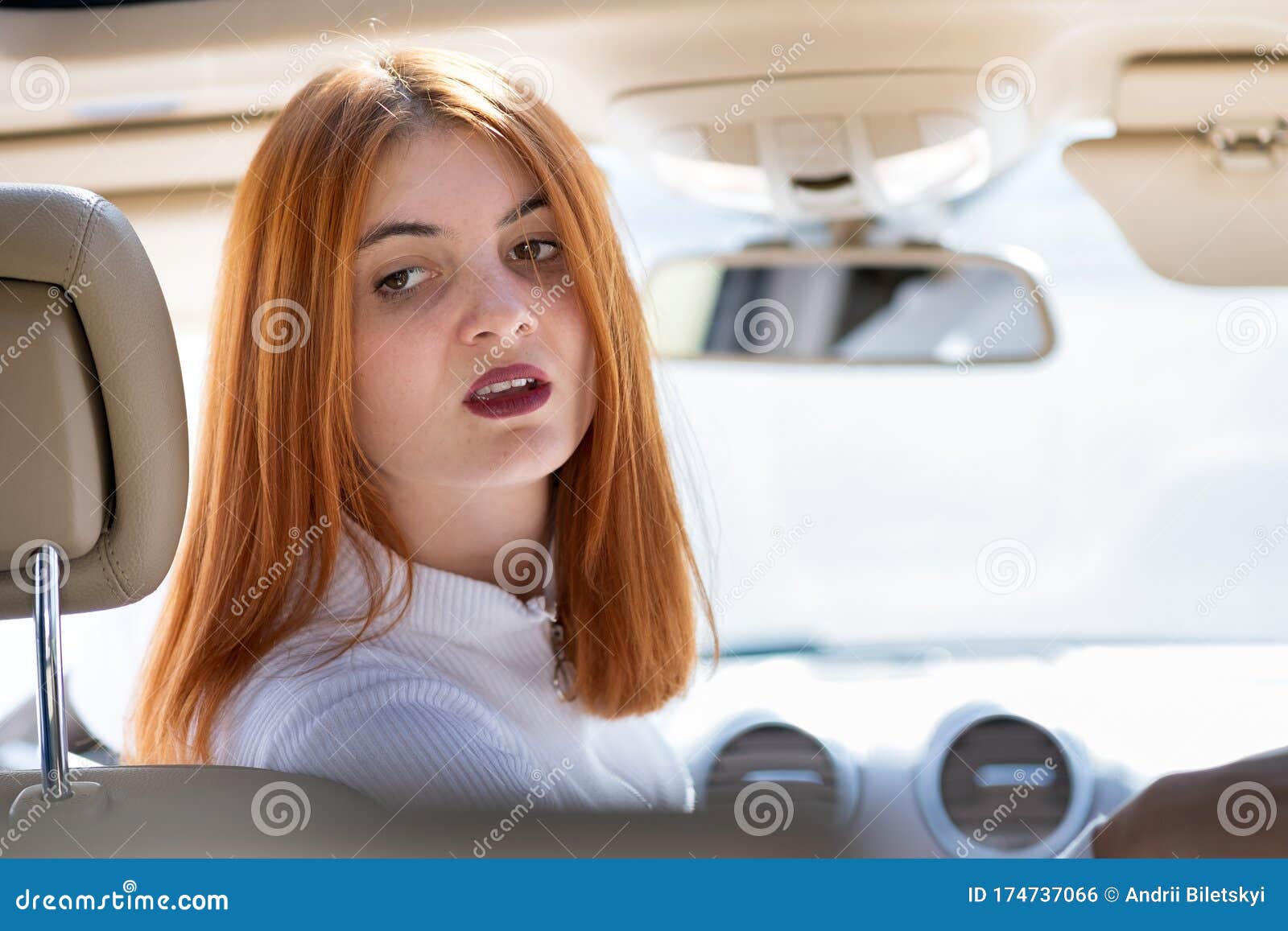 Young Redhead Woman Driver Driving a Car Backwards Stock Photo - Image ...