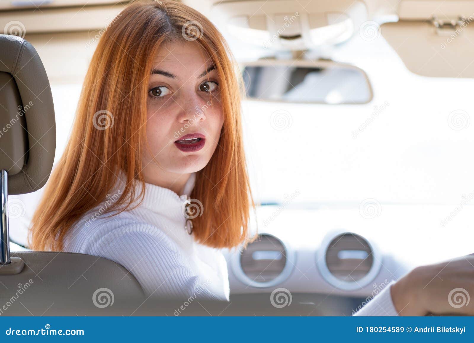 Young Redhead Woman Driver Driving a Car Backwards Stock Image - Image ...