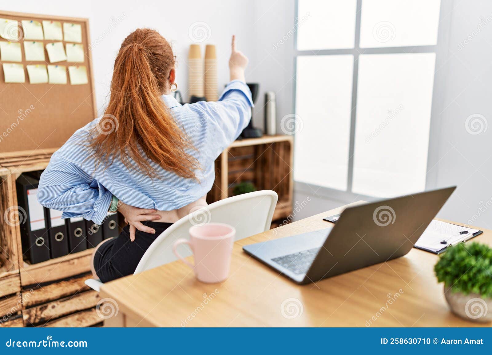 Young Redhead Woman Working at the Office Using Computer Laptop Posing ...