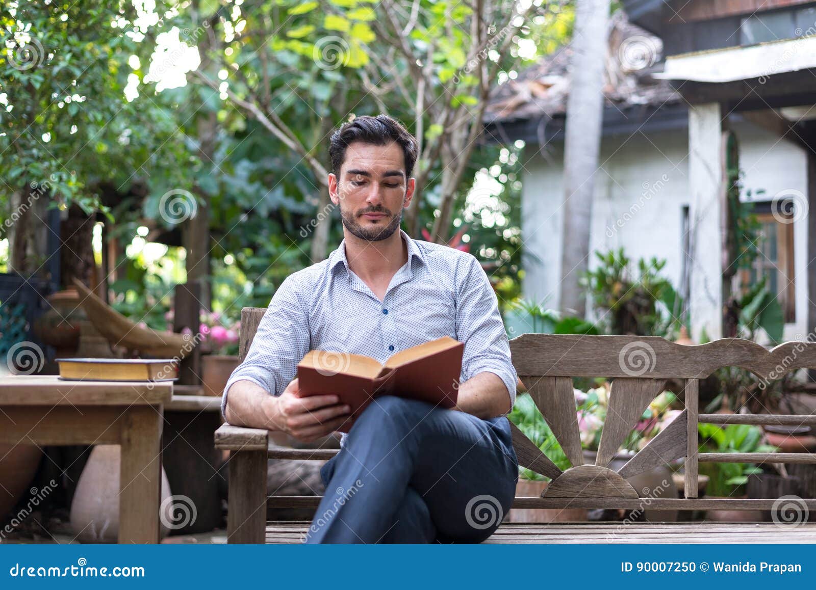 Young Relaxed Man Reading Book Stock Photo - Image of book, diversity ...