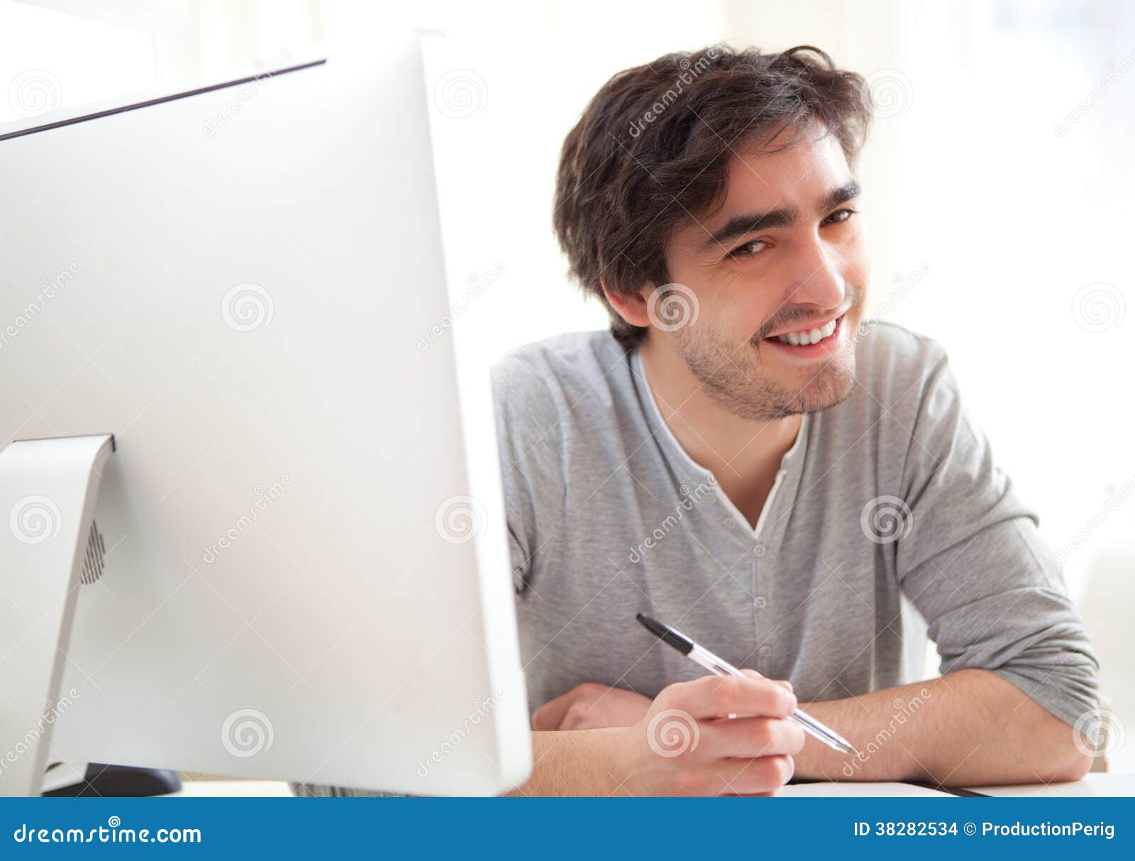 Young Relaxed Men Writting at the Office Stock Photo - Image of beard ...