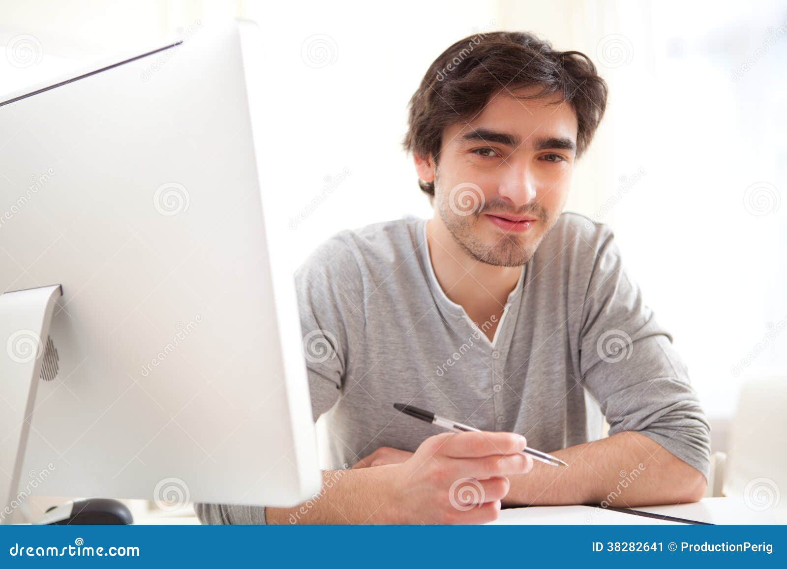 Young Relaxed Men Writting at the Office Stock Image - Image of happy ...
