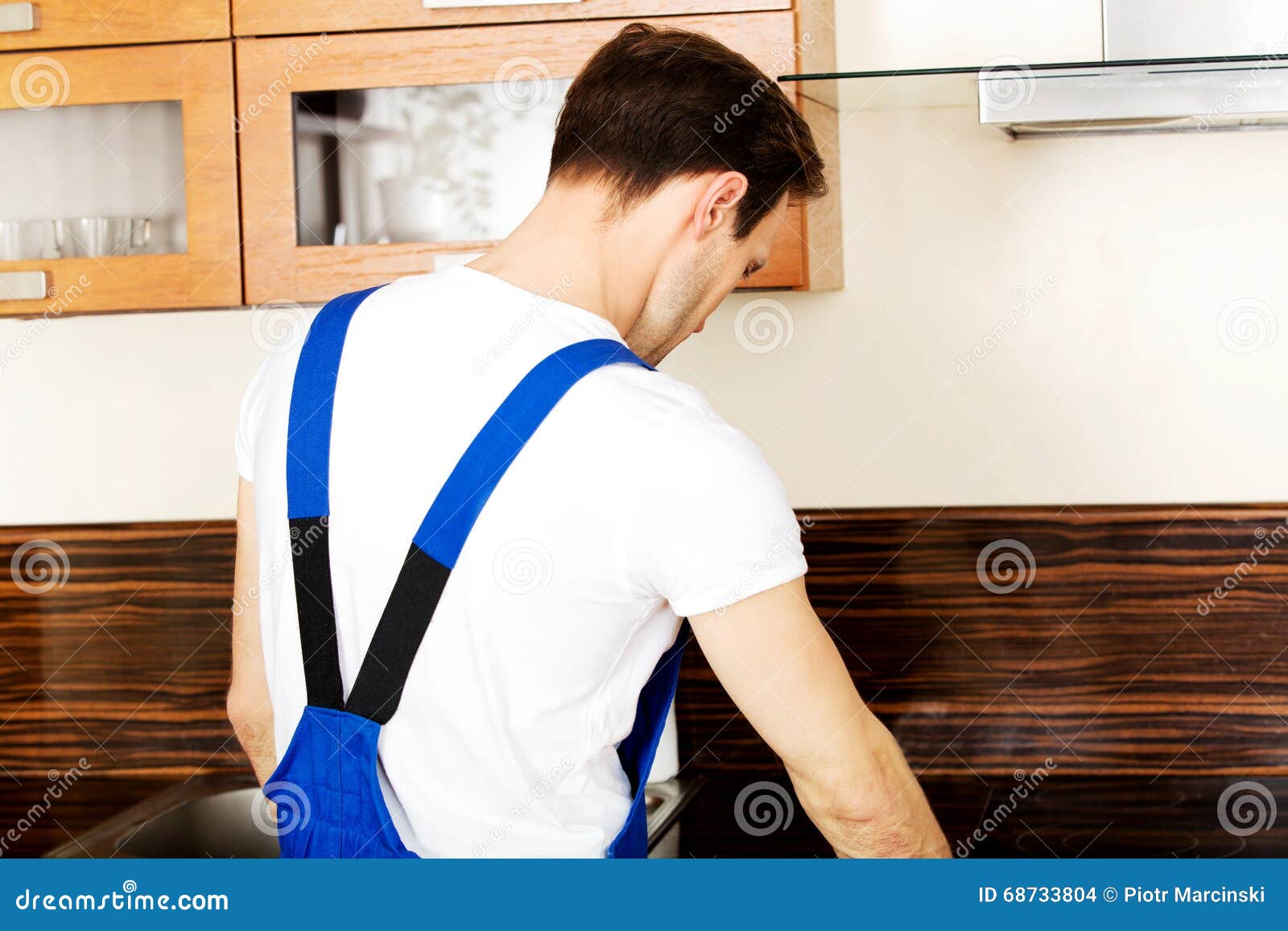 Young Repair Man Measuring Kitchen Cabinet Stock Photo - Image of ...