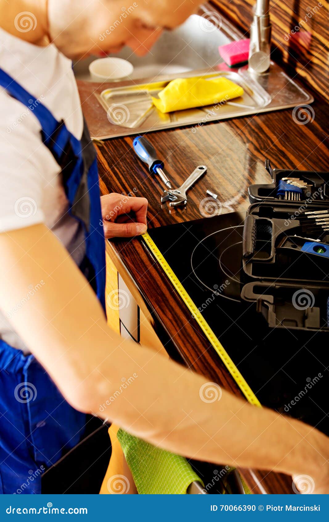 Young Repair Man Measuring Kitchen Cabinet Stock Photo - Image of ...