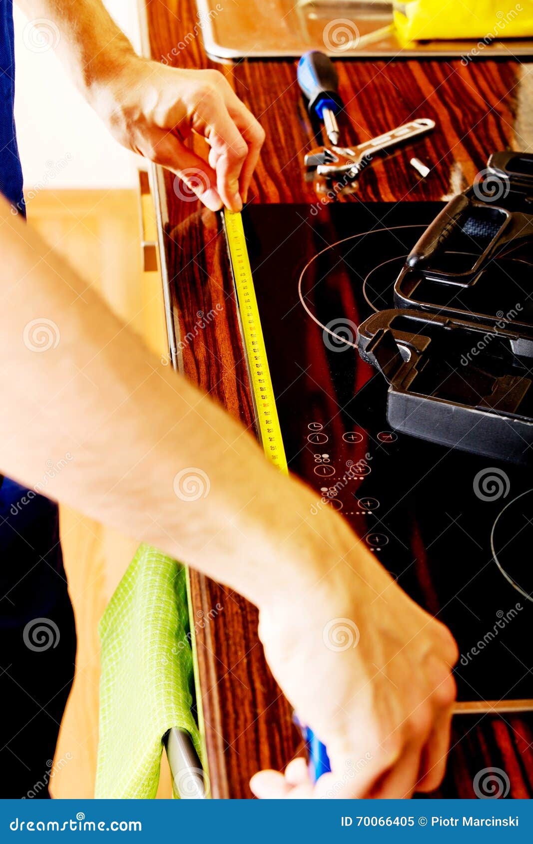 Young Repair Man Measuring Kitchen Cabinet Stock Image - Image of ...