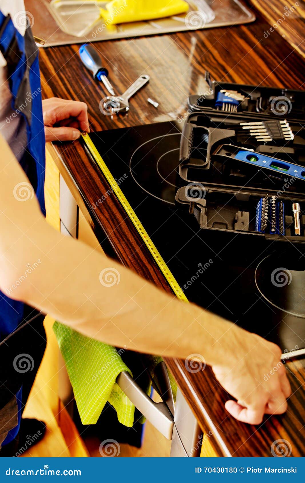 Young Repair Man Measuring Kitchen Cabinet Stock Photo - Image of ...