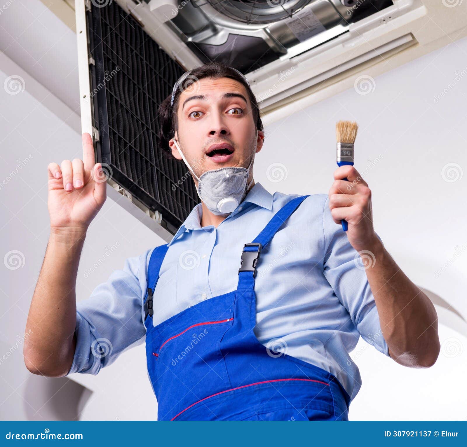 Young Repairman Repairing Ceiling Air Conditioning Unit Stock Image ...