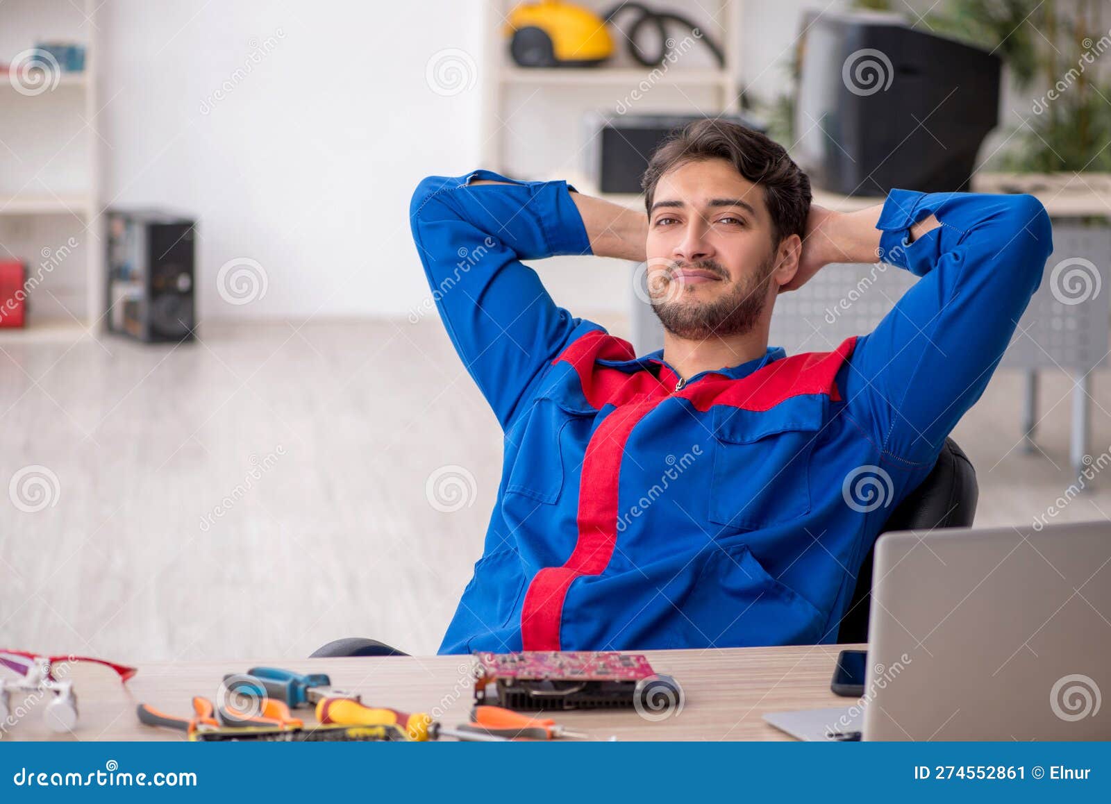 Young Male Repairman Repairing Computer Stock Image - Image of tired ...