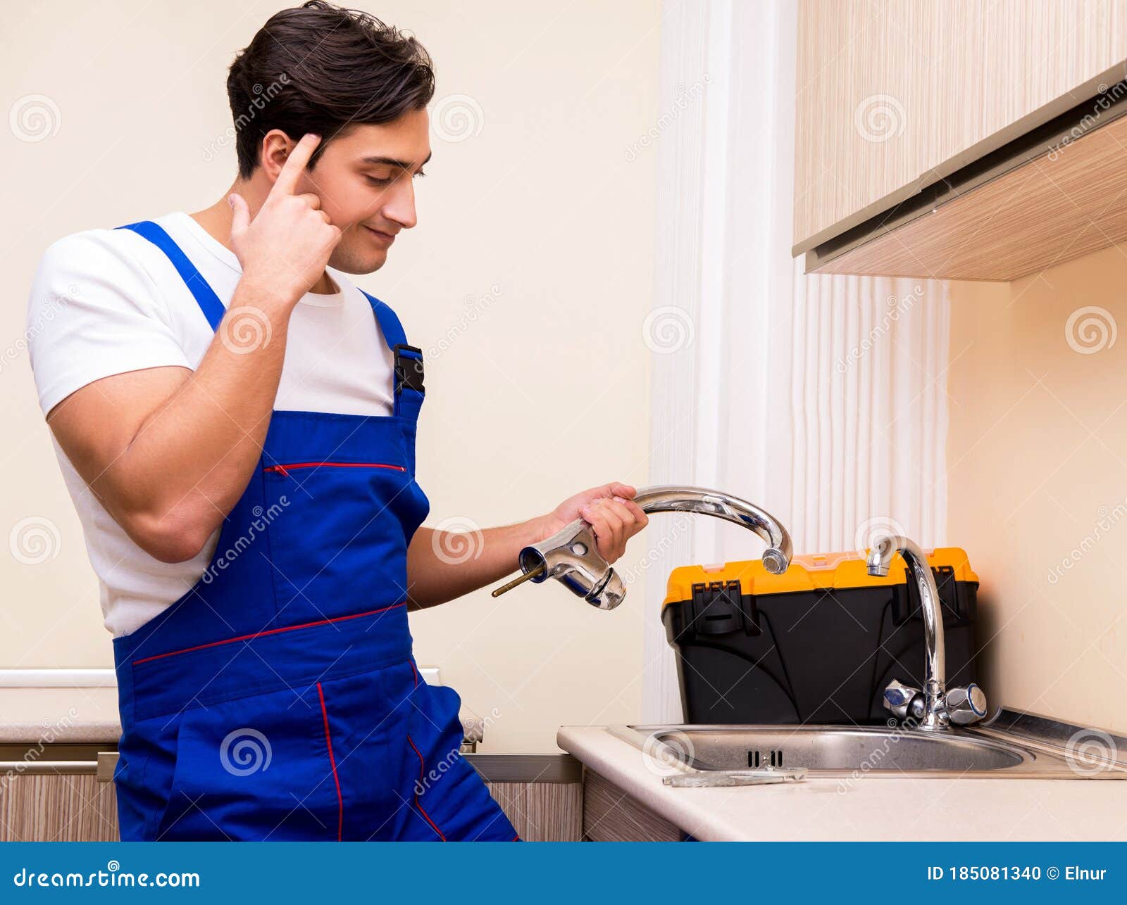 Young Repairman Working at the Kitchen Stock Photo - Image of ...