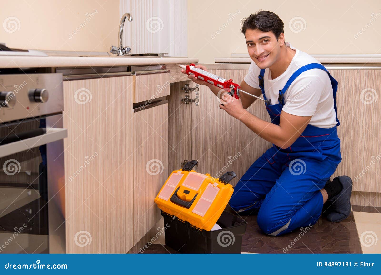 The Young Repairman Working at the Kitchen Stock Image - Image of pipe ...