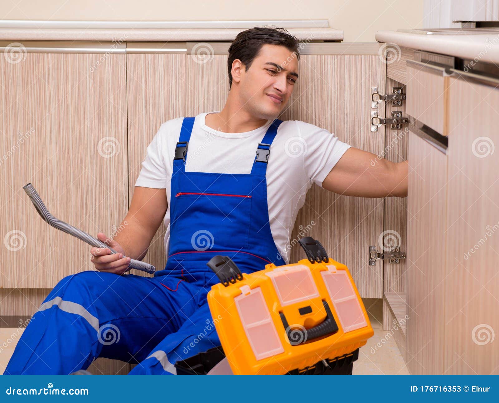 Young Repairman Working at the Kitchen Stock Image - Image of happy ...