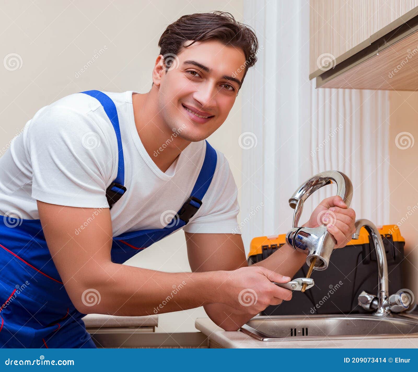Young Repairman Working at the Kitchen Stock Photo - Image of handyman ...