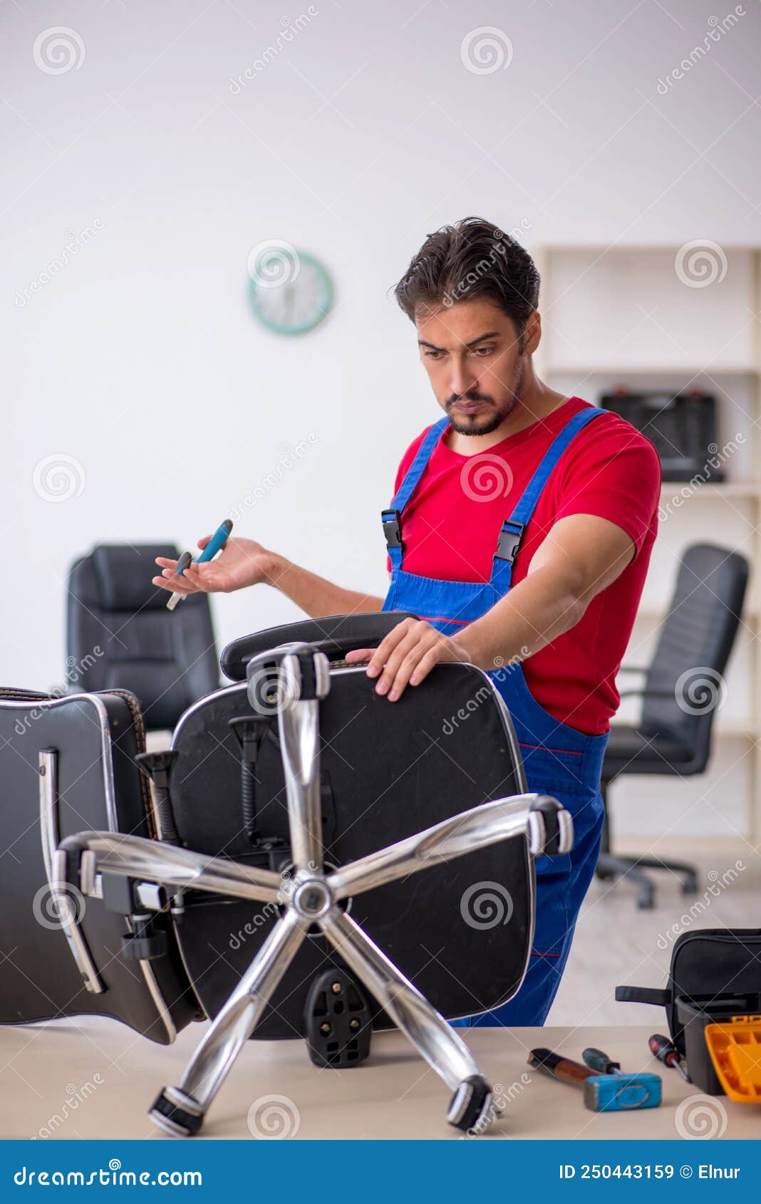 Young Male Repairman Working at Workshop Stock Image - Image of ...