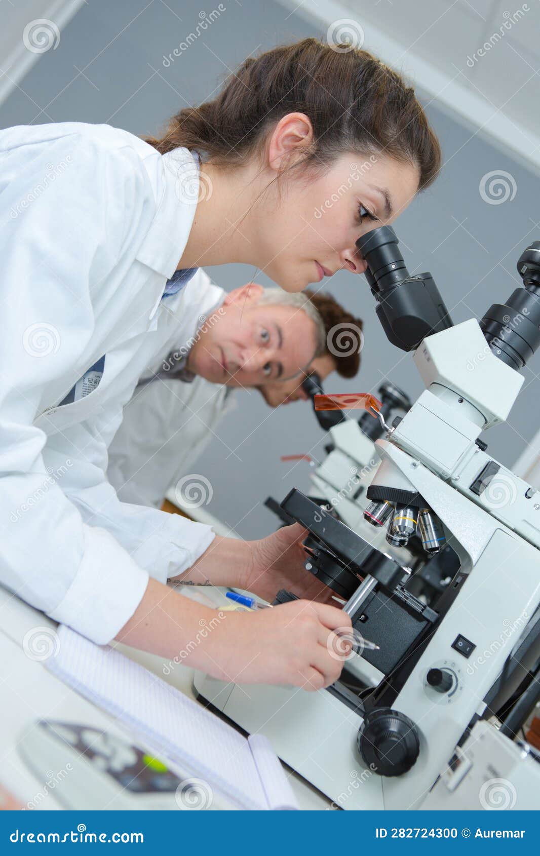 Young Researcher Working with Microscope in Lab Stock Photo - Image of ...