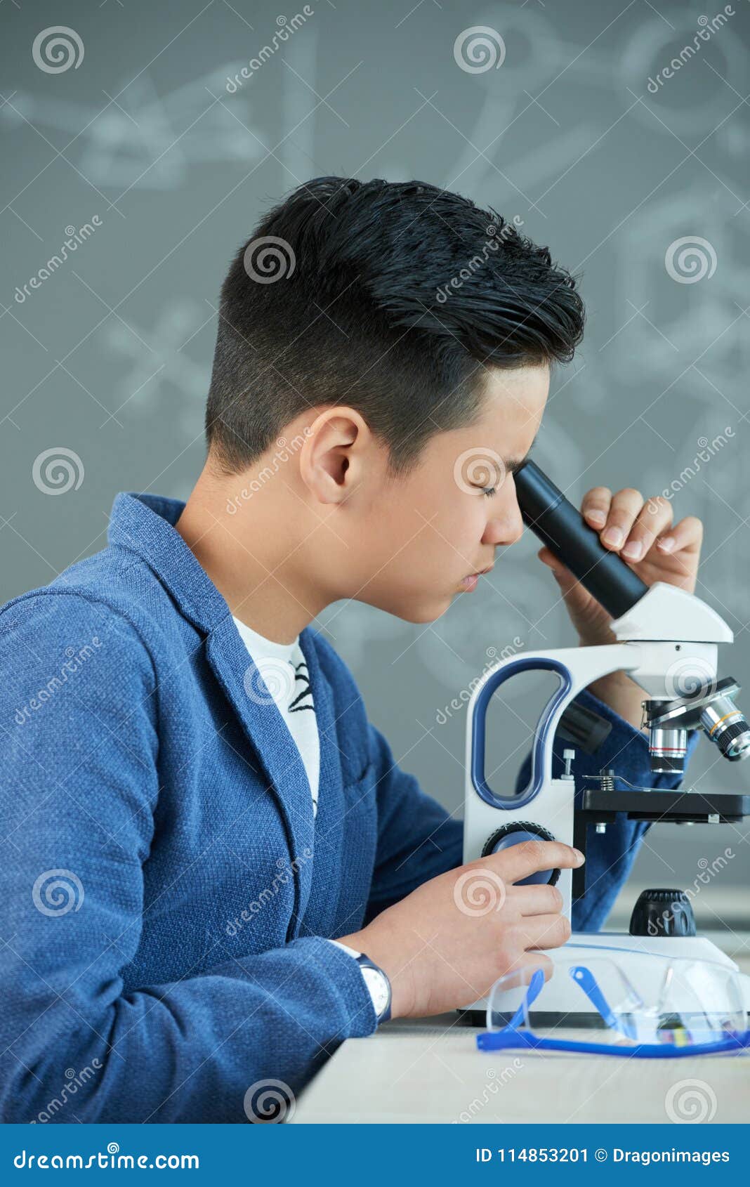Young Researcher Wrapped Up in Work Stock Image - Image of microscope ...