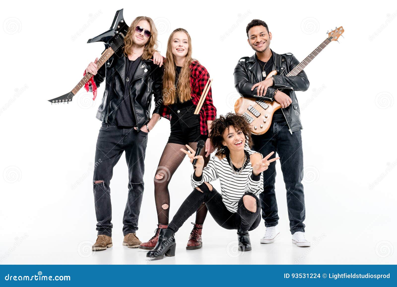 Young Rock and Roll Band Standing with Microphone, Drumsticks and ...