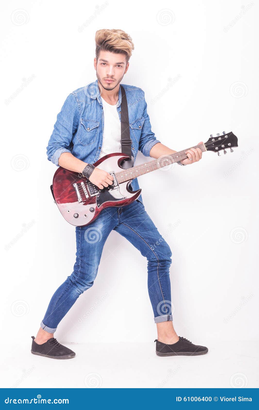 Young Rocker Playing His Red Electric Guitar Stock Photo - Image of ...