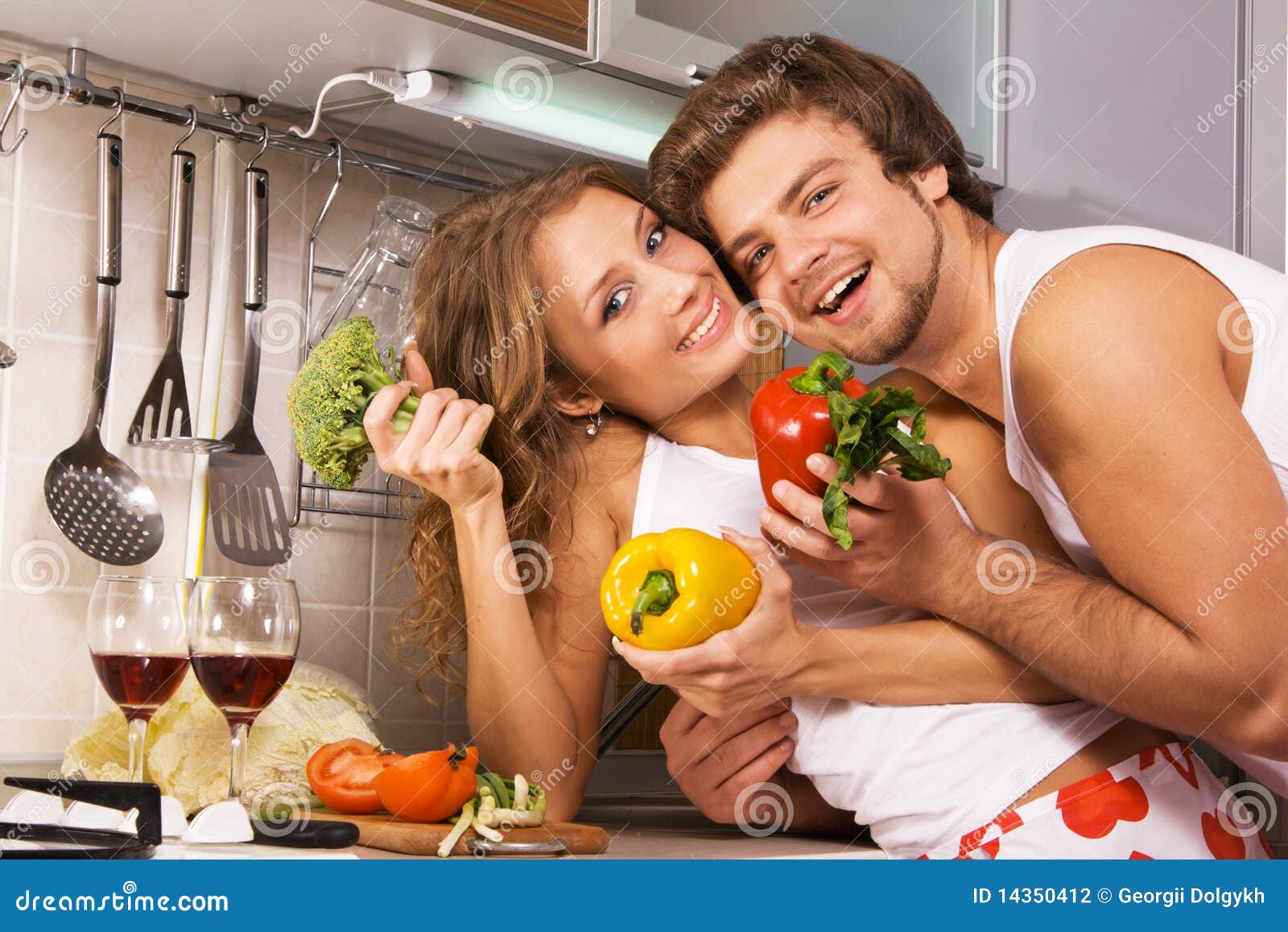 Young Romantic Couple in the Kitchen Stock Photo - Image of embrace ...