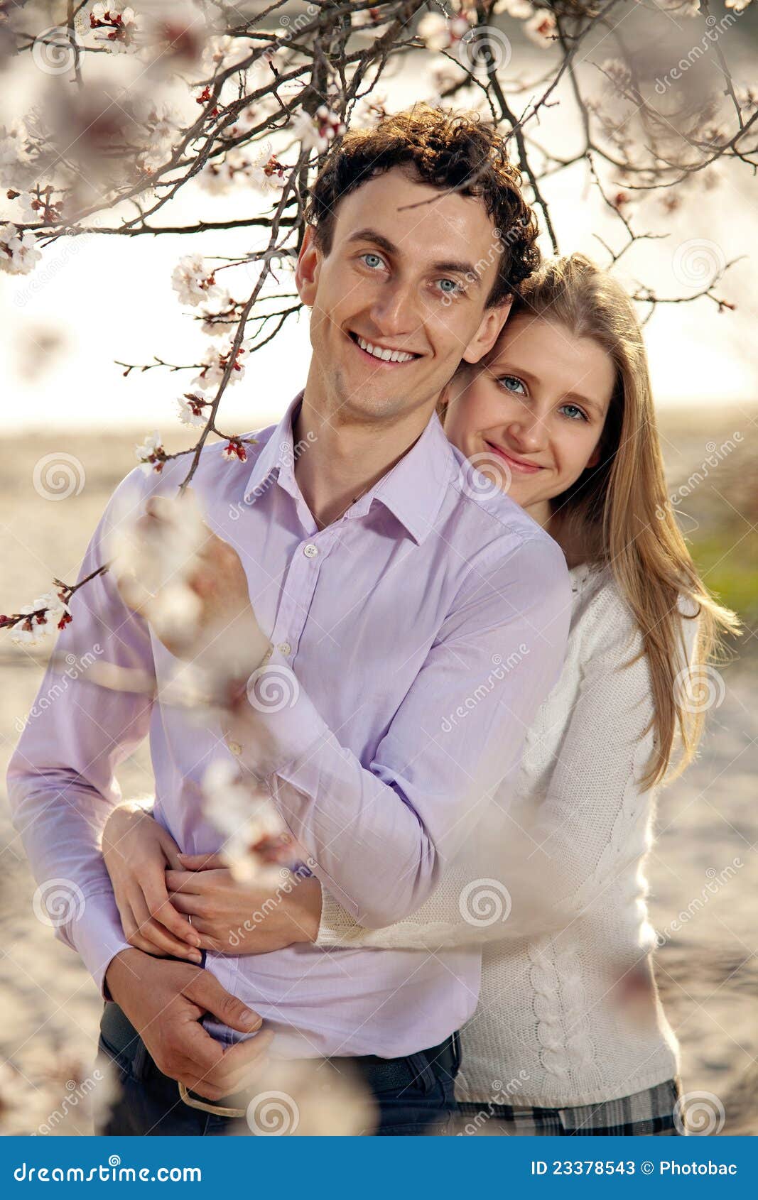 Young Romantic Couple in Spring Blossom Stock Image - Image of flowers ...