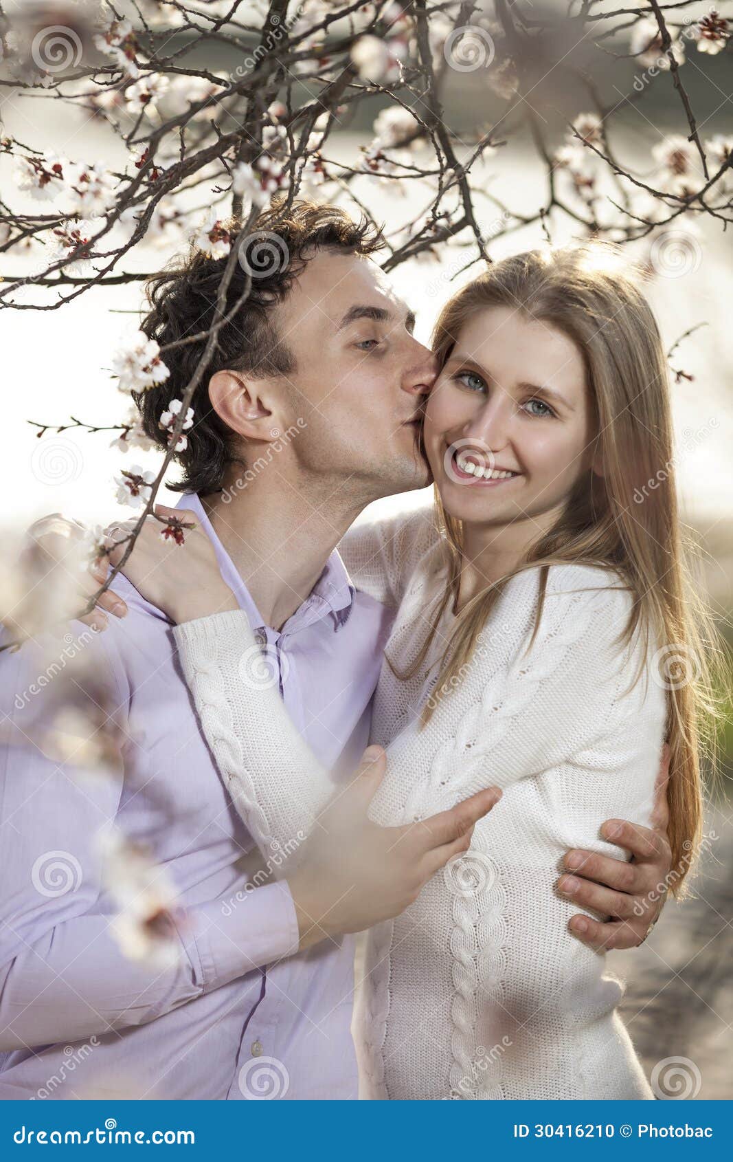 Young Romantic Couple in Spring Blossom Stock Photo - Image of ...