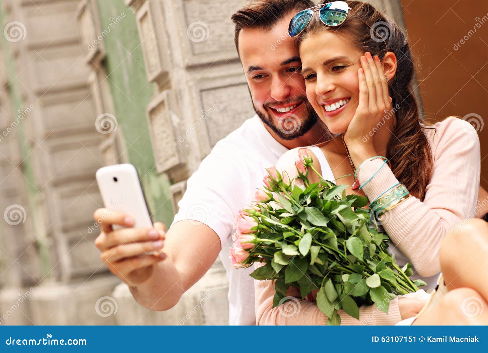 Young Romantic Couple Using Smartphone in the City Stock Image - Image ...
