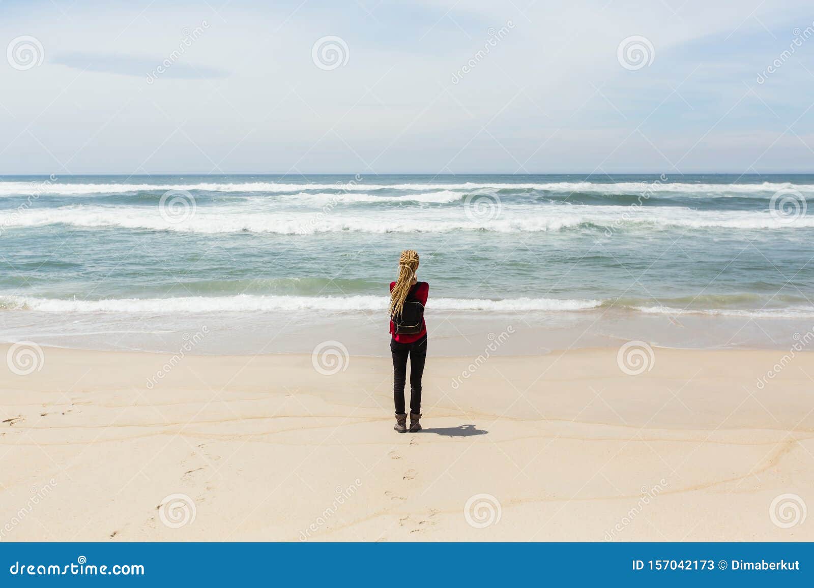 Young Romantic Woman, View from the Back, Standing on Shore Watching ...