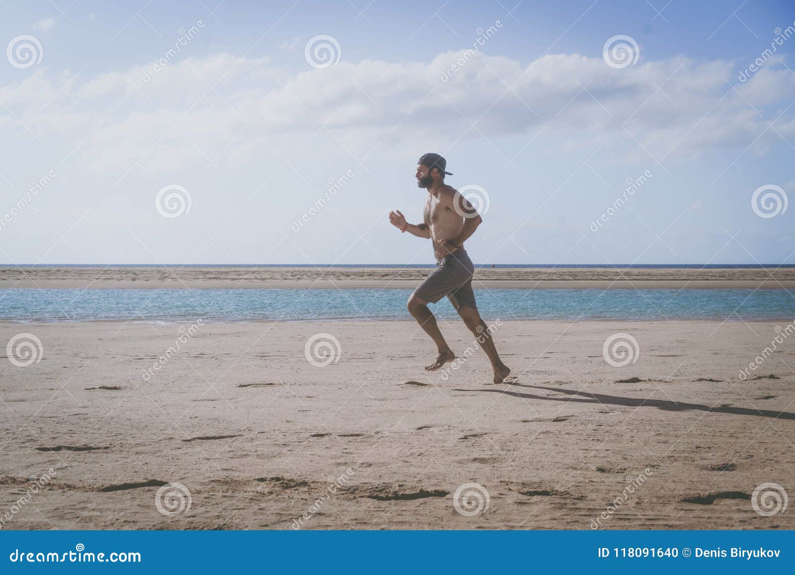 Young Runner Running in Morning Along the Beach. Stock Photo - Image of ...