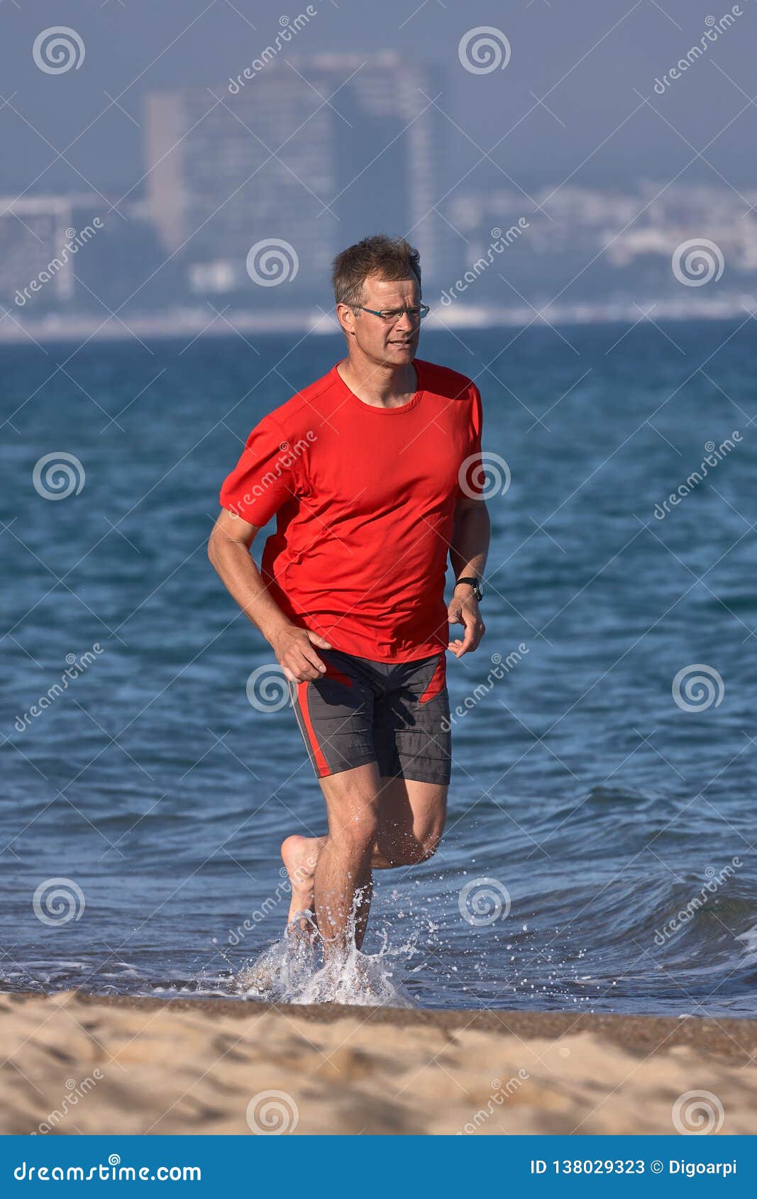 Young Runner Running in Red T-shirt at Springtime on the Spanish Beach ...