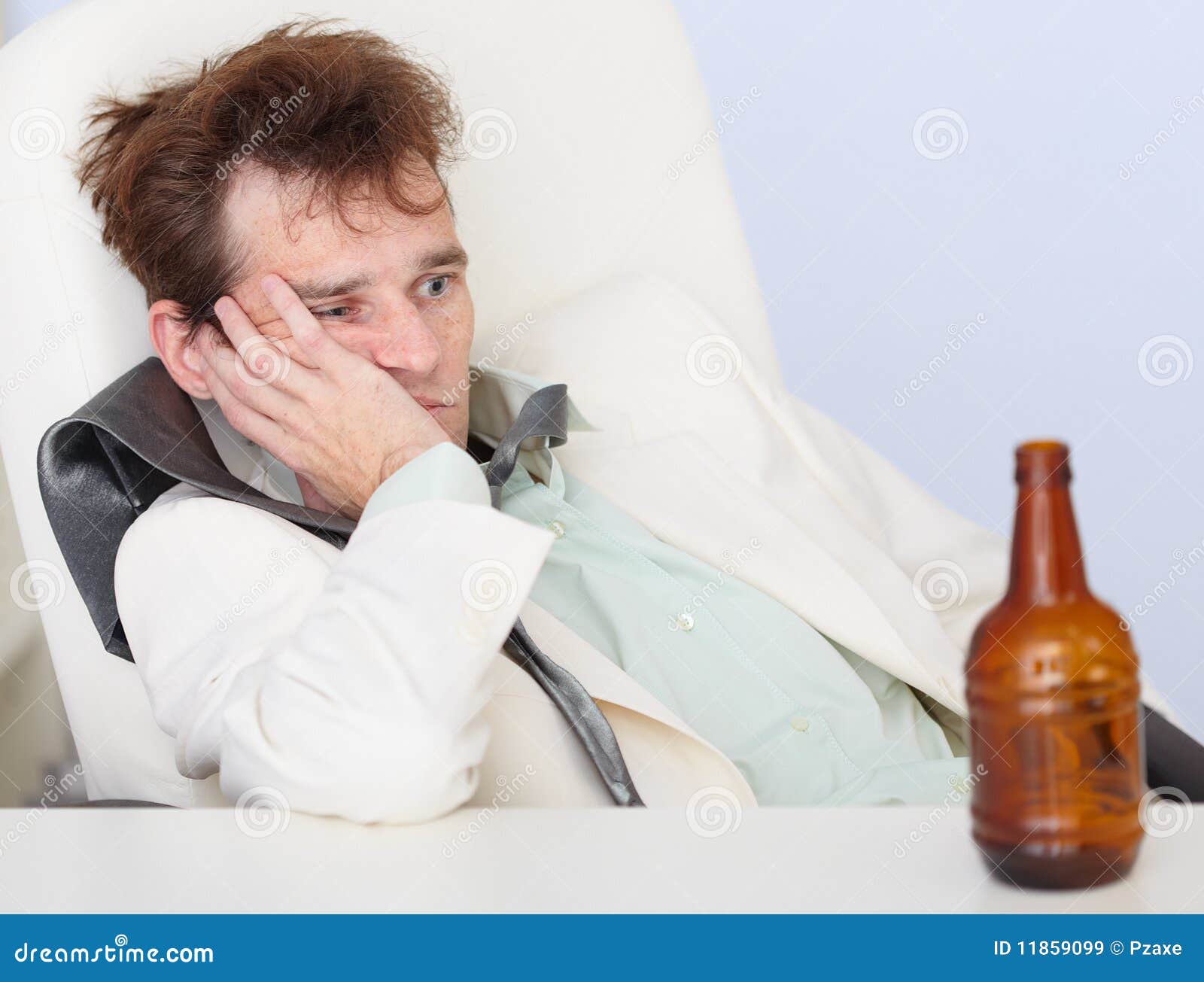 Young Sad Businessman Sits with an Empty Bottle Stock Image - Image of ...