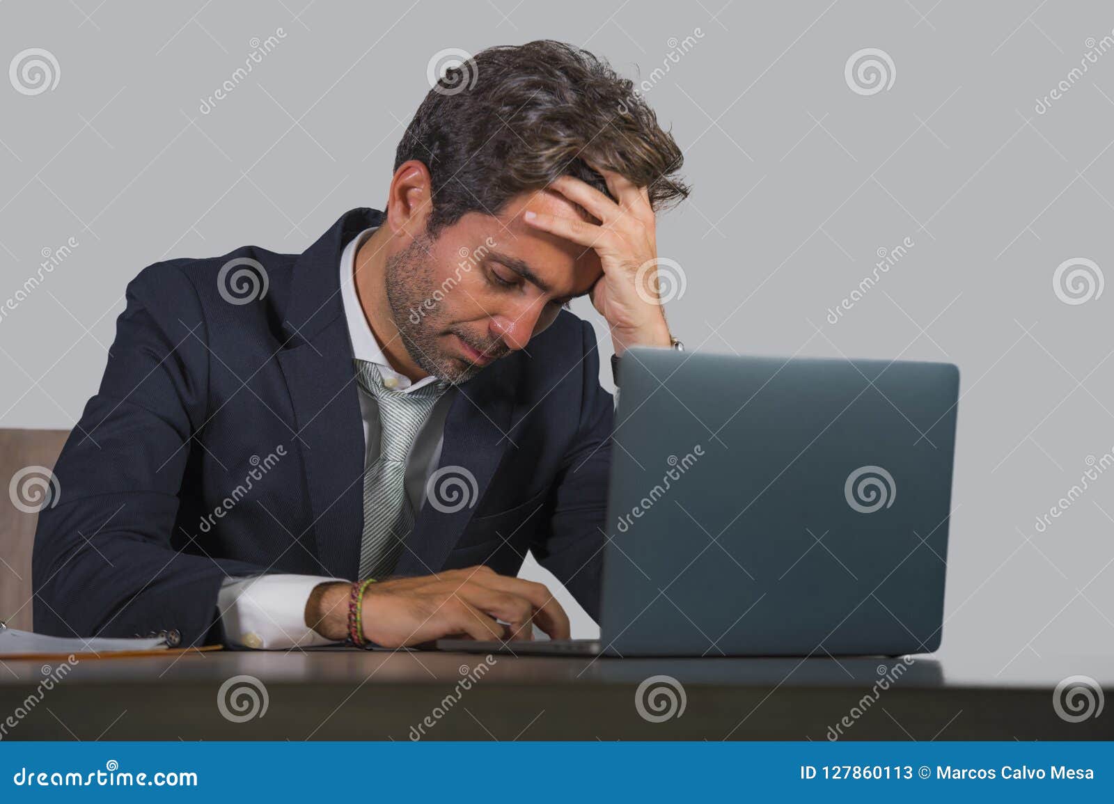 Young Sad and Depressed Business Man Working Overwhelmed and Frustrated ... Young Sad and Depressed Business Man Working Overwhelmed and Frustrated ...