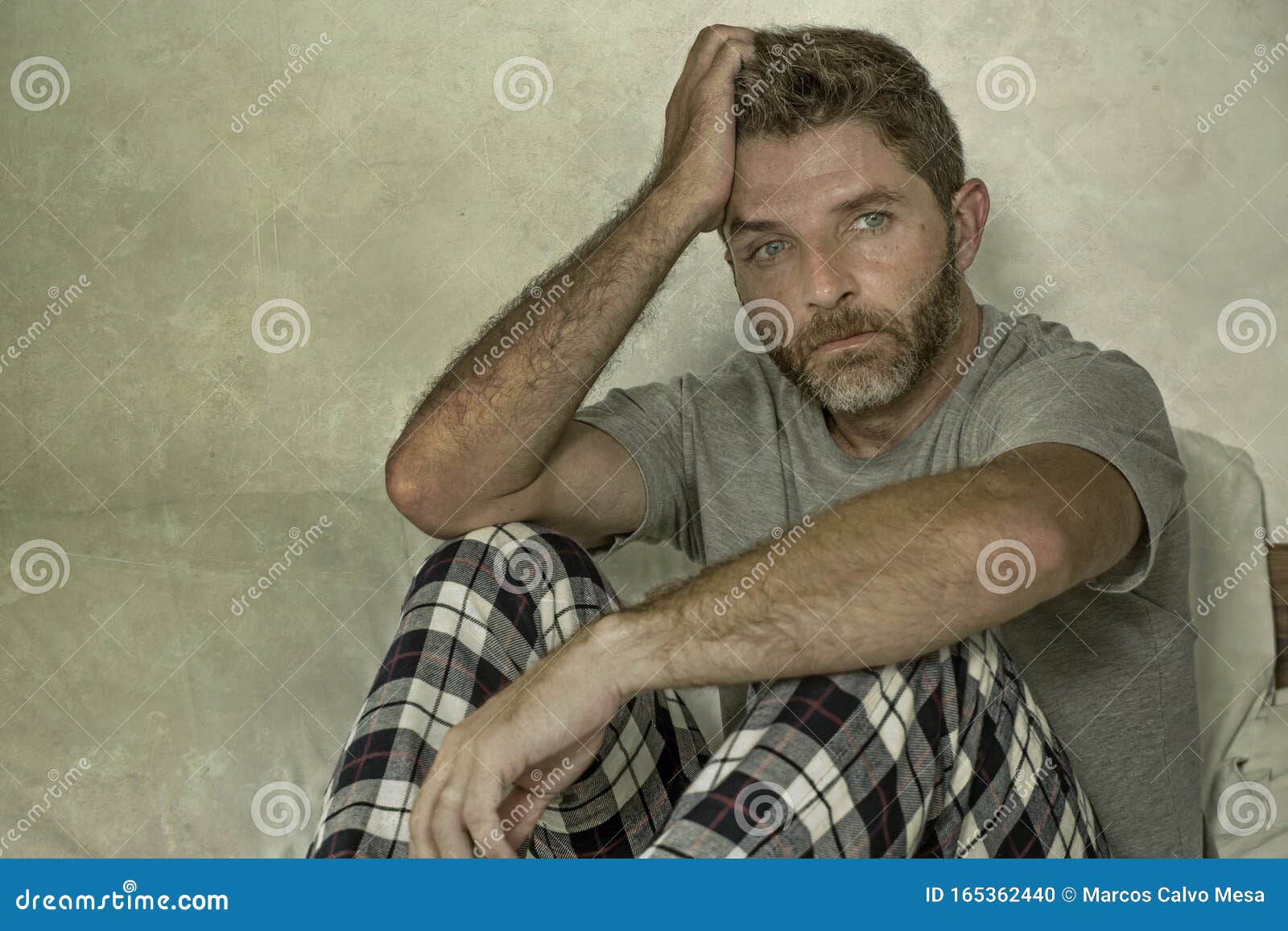 Young Sad and Depressed Man Lying Thoughtful and Pensive on Bed Looking ...