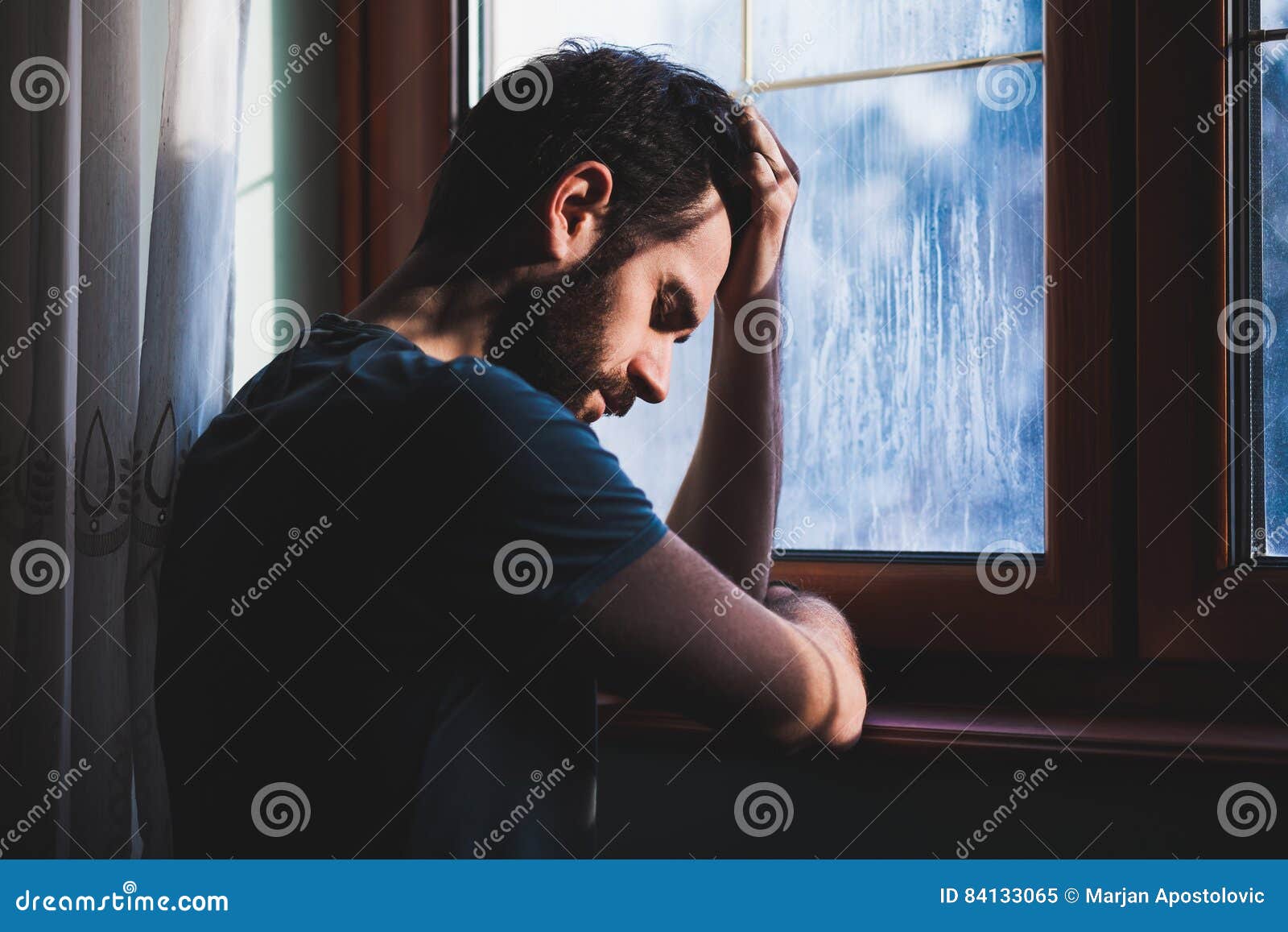 Young Sad Mad Sitting by the Window Stock Image - Image of lost ...