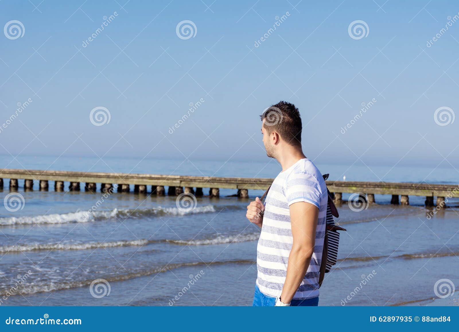 Young Sad Man Standing Alone on the Beach Stock Image - Image of ...