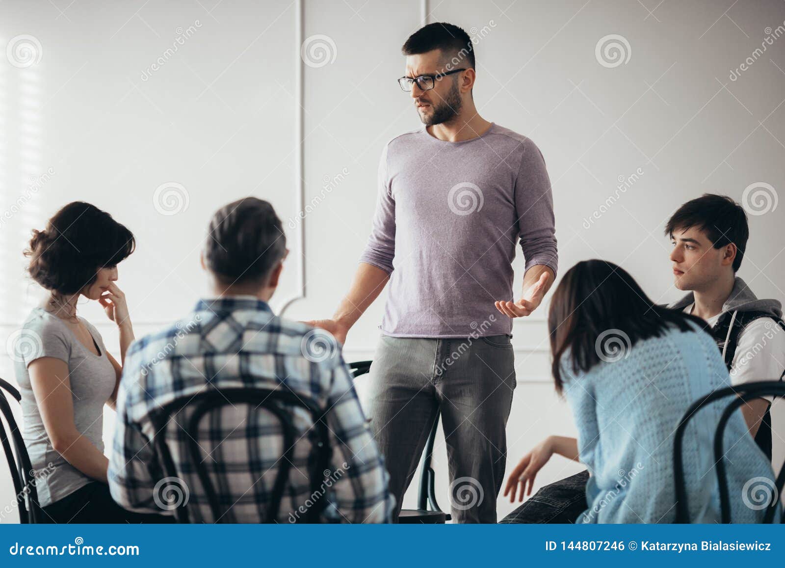 Young Sad Man Talking To the People during Psychotherapy Stock Photo ...